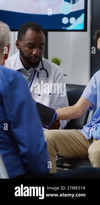 Vertical video: Physician doing insulin level measurement with medical ...