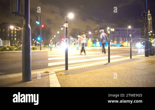 Pedestrians crossing street on green traffic light, transportation ...