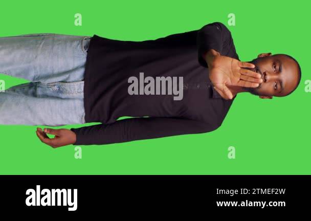 Vertical video: Front view of negative adult showing no sign with palm ...