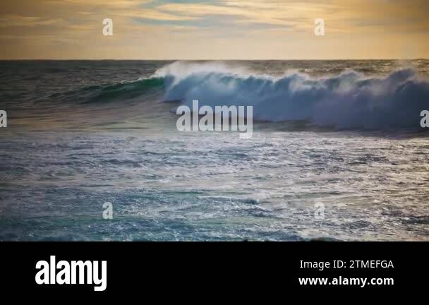 Powerful ocean surf rolling seashore on sunny morning. Slow motion huge ...