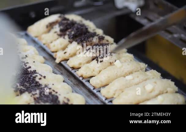 The making of traditional snack from Indonesia named Pukis. Pukis is a ...