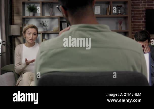 A quarrel between a husband and wife at a psychotherapists appointment ...