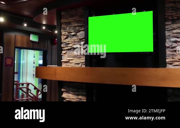 Display tv with green screen inside mcdonalds fast food restaurant ...