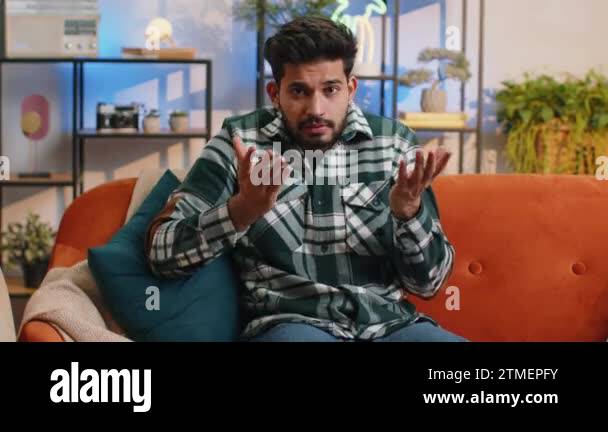 Indian man raising hands asking what why reason of failure, disbelief ...