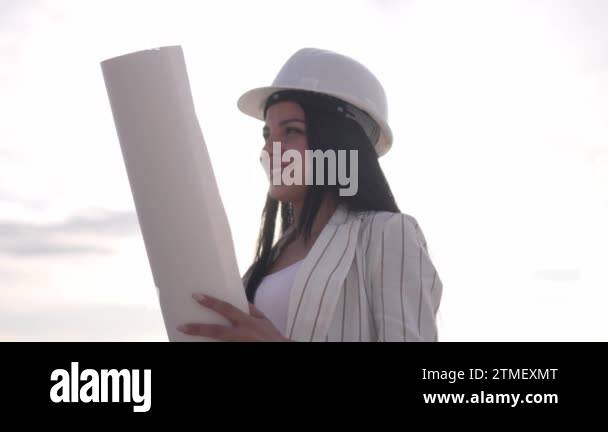 female civil engineer. An architect with drawing on paper. young woman ...
