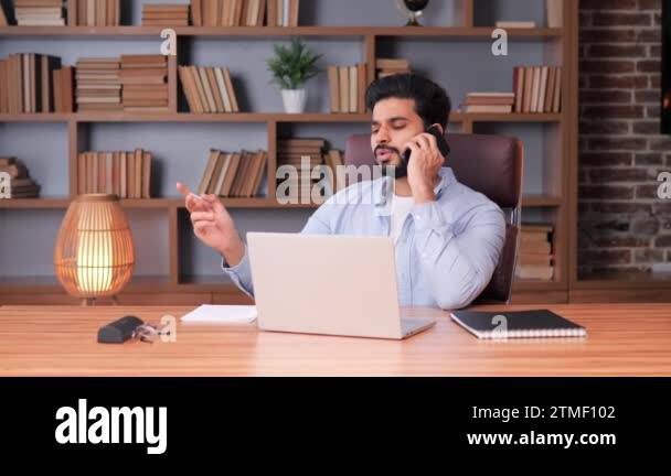 Indian businessman handling multiple tasks simultaneously as he ... Indian businessman handling multiple tasks simultaneously as he ...