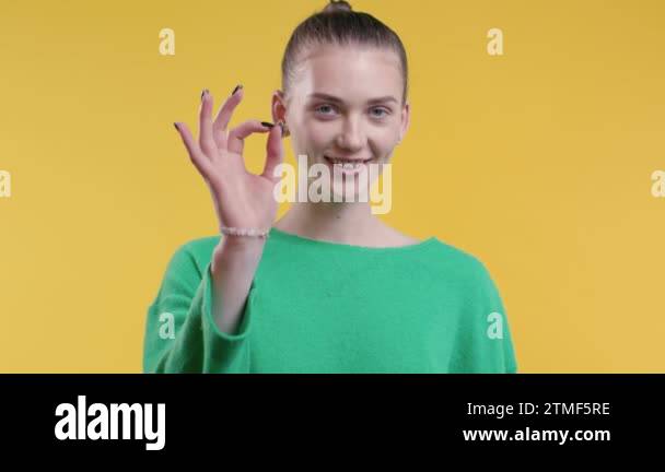 Pretty woman makes hand sign okay, ok gesture. Happy girl, correct ...