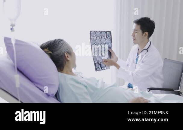 Specialist doctor holding patient x-ray explaining disease diagnosis ...