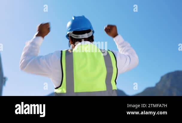 Celebration, engineering and construction worker cheering on a site for ...
