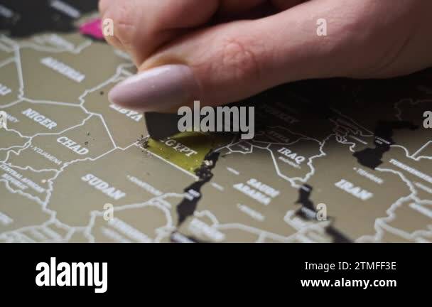 Scratching Egypt Country on the Surface of Scratch World Map. Woman ...