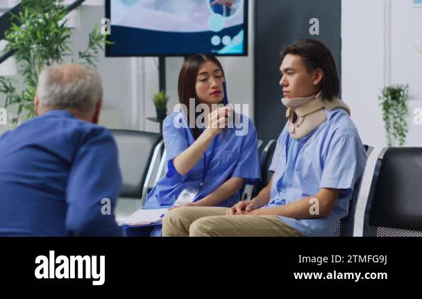 Asian nurse doing brain damage exam, checking concussion and having ...