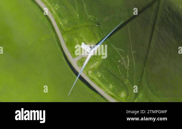 Rotating top down aerial view of powerful Wind turbine for energy ...