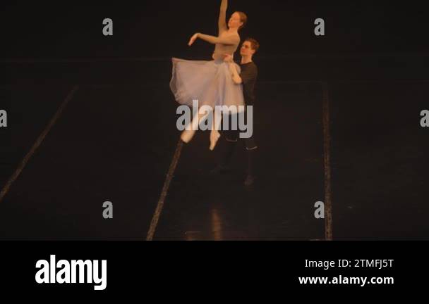 Graceful ballet dancers practice lifts and spinning ballet movements ...