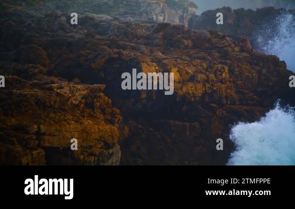 Wild ocean cliff view on storm day closeup. Powerful waves splashing ...