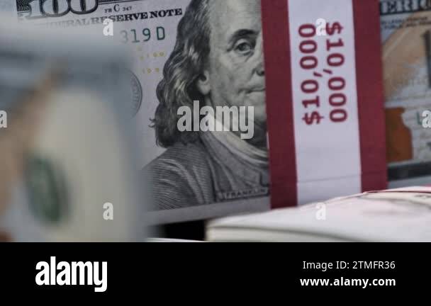 Stacks of dollars rotate close-up. Bundles of 10000 American dollars ...