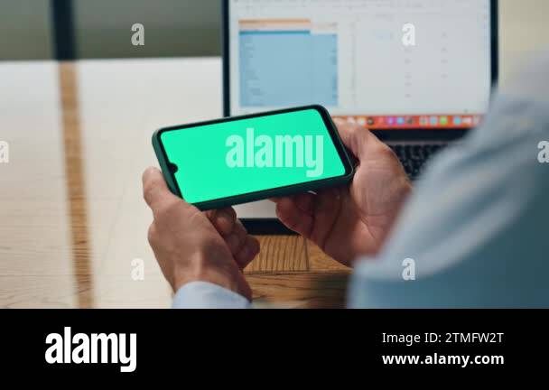 Boss fingers hold mockup cellphone at office closeup. Anonymous leader ...