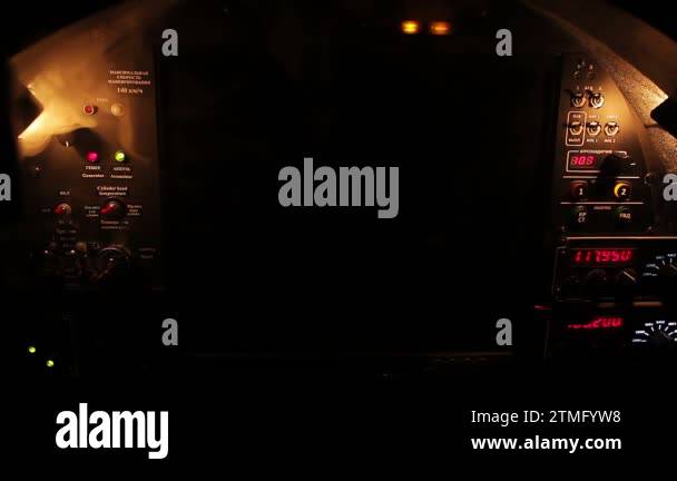 Fire alarm signal blinking red on dark cockpit panel, smoke spreading ...