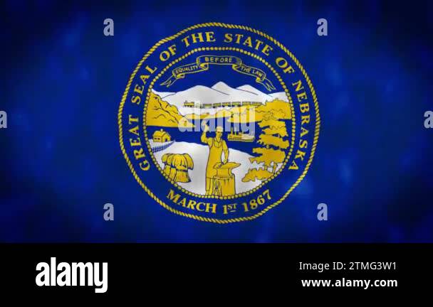 Close-up of the Nebraska state flag fluttering. The flag of is blue ...