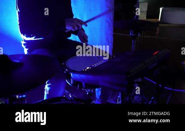 Drummers hands with sticks at a concert close-up. Twilight. The drummer ...