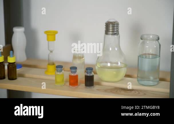 Home school chemistry class laboratory with reagents, jars, flasks and ...