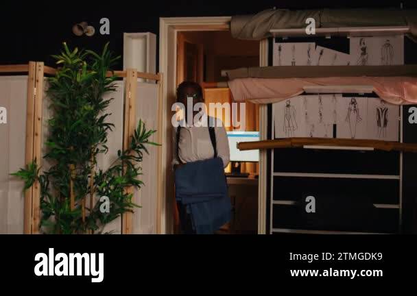 Tailor and student choosing design to create tailored clothes custom ...