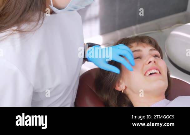 Dentist injects anesthetic syringe diseased teeth for patient to white ...