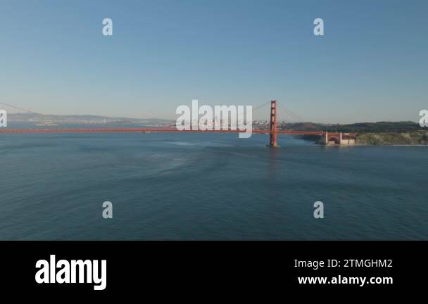 Aerial panoramic footage of famous Golden Gate Bridge spanning strait ...