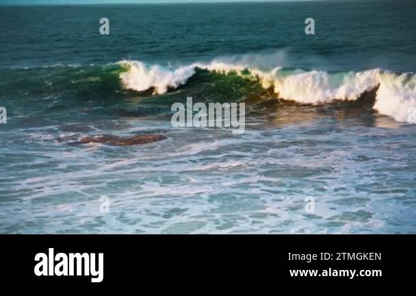 White sea waves rolling seashore on sunny day. Slow motion ocean ...