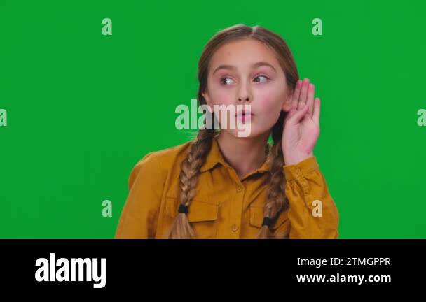 Portrait of brunette girl with hazel eyes listening rumor with ...