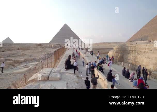 Giza, Egypt. December 2022. RIGHT PAN. Many tourists walk and take ...