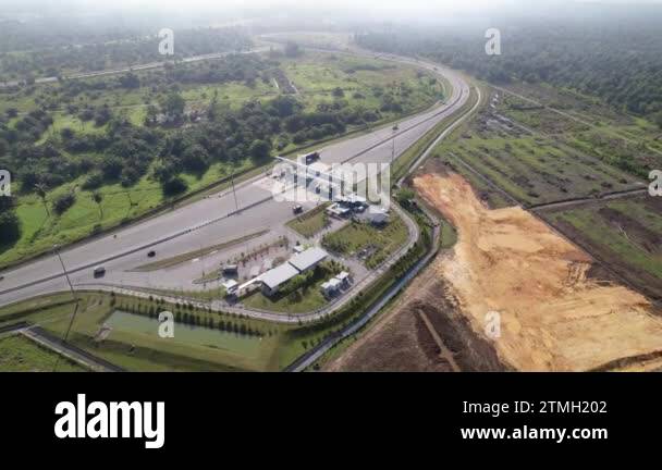 Selangor, Malaysia - Wed 22, 2023 Aerial circle view of the Kapar Toll Plaza in Klang near the ...
