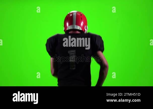Guy throwing a football and running. Slow movement, Green screen Stock ...