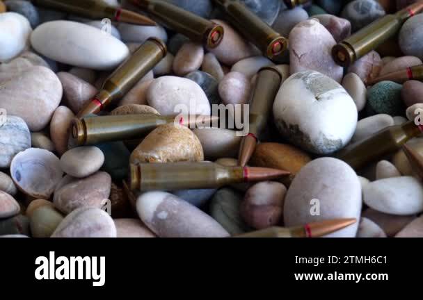 4K closeup video of rotation of bullets are sprinkled with smooth ...