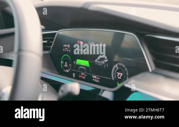 Dashboard of an electric car while driving. Speedometer and tachometer ...