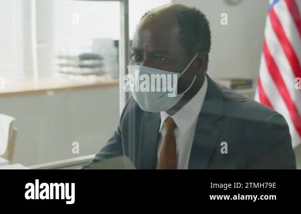 PAN shot of African American consular officer and Caucasian visa ...