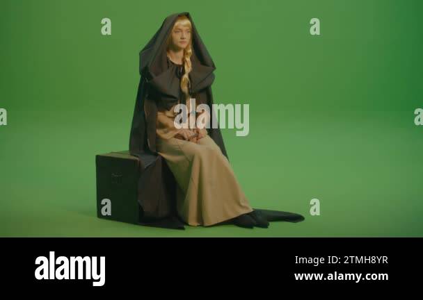 Green Screen. Woman Sorceress With a Magic Wand Sitting on the Magic ...
