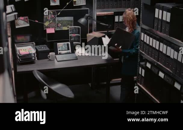 Private agency detective conducting investigation with map and ...