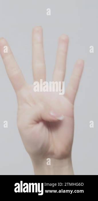 Vertical video. Hand gesture. Countdown timer. Woman bending fingers ...