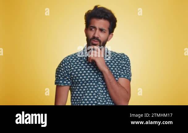 Eureka. Inspired young indian man pointing finger up with open mouth ...