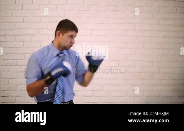 Businessman with boxing gloves. Boxing man in a shirt and tie. Manager ...