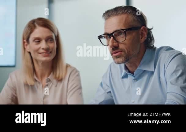 Professional man talking colleagues at office closeup. Business couple ...