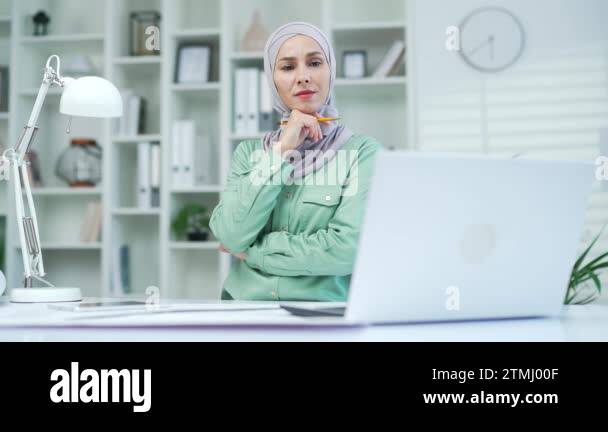 Thoughtful Muslim woman, employee, manager or agent architect creative ... Thoughtful Muslim woman, employee, manager or agent architect creative ...