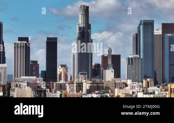 Slide and pan footage of modern high rise office towers in financial ...