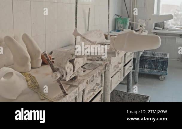 No people shot of human limb plaster casts and various tools on ...
