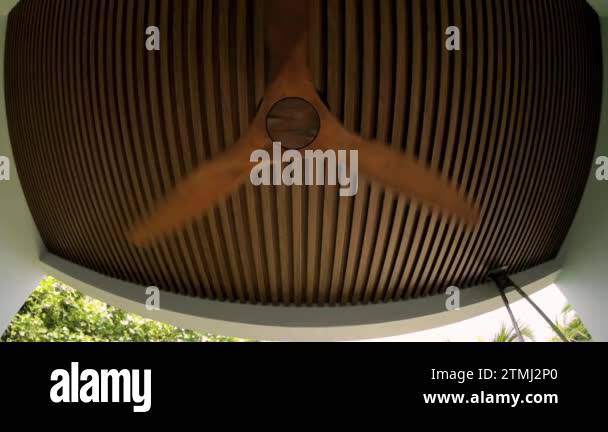Ceiling fan on wooden roof electric ceiling fan rotating slowly and air ...