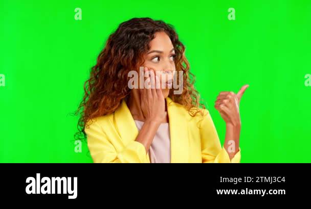 Shock, green screen and woman in a studio pointing at mockup space for advertising or marketing ...