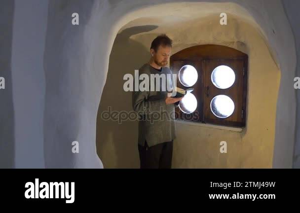 Man Inside a Small Room Cave Monastery Reading Bible Svyatogorsk Lavra ...