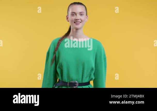 Friendly young girl showing yes signal, nods head, approve. Positive ...