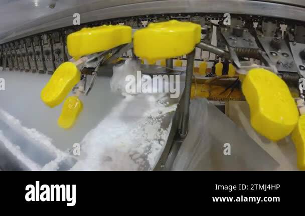 Freezing ice cream at the factory. Automatic production of ice cream ...