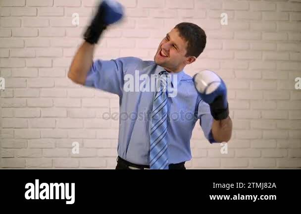 Businessman with boxing gloves celebrating the victory. Man in boxing ...